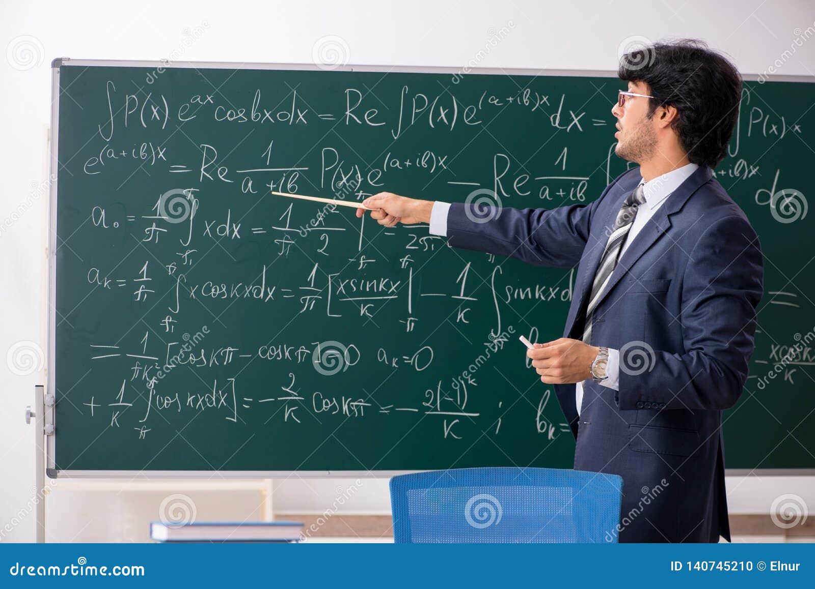 The Young Male Math Teacher in Classroom Stock Photo - Image of ...