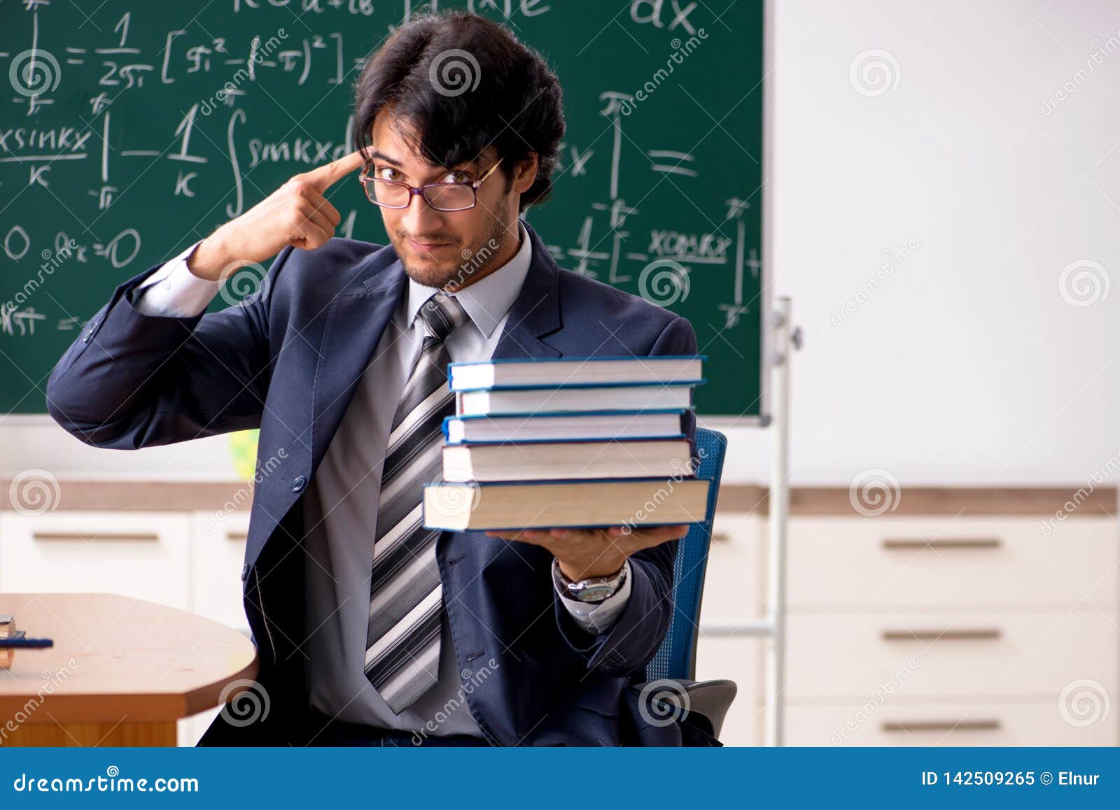 The Young Male Math Teacher in Classroom Stock Image - Image of ...