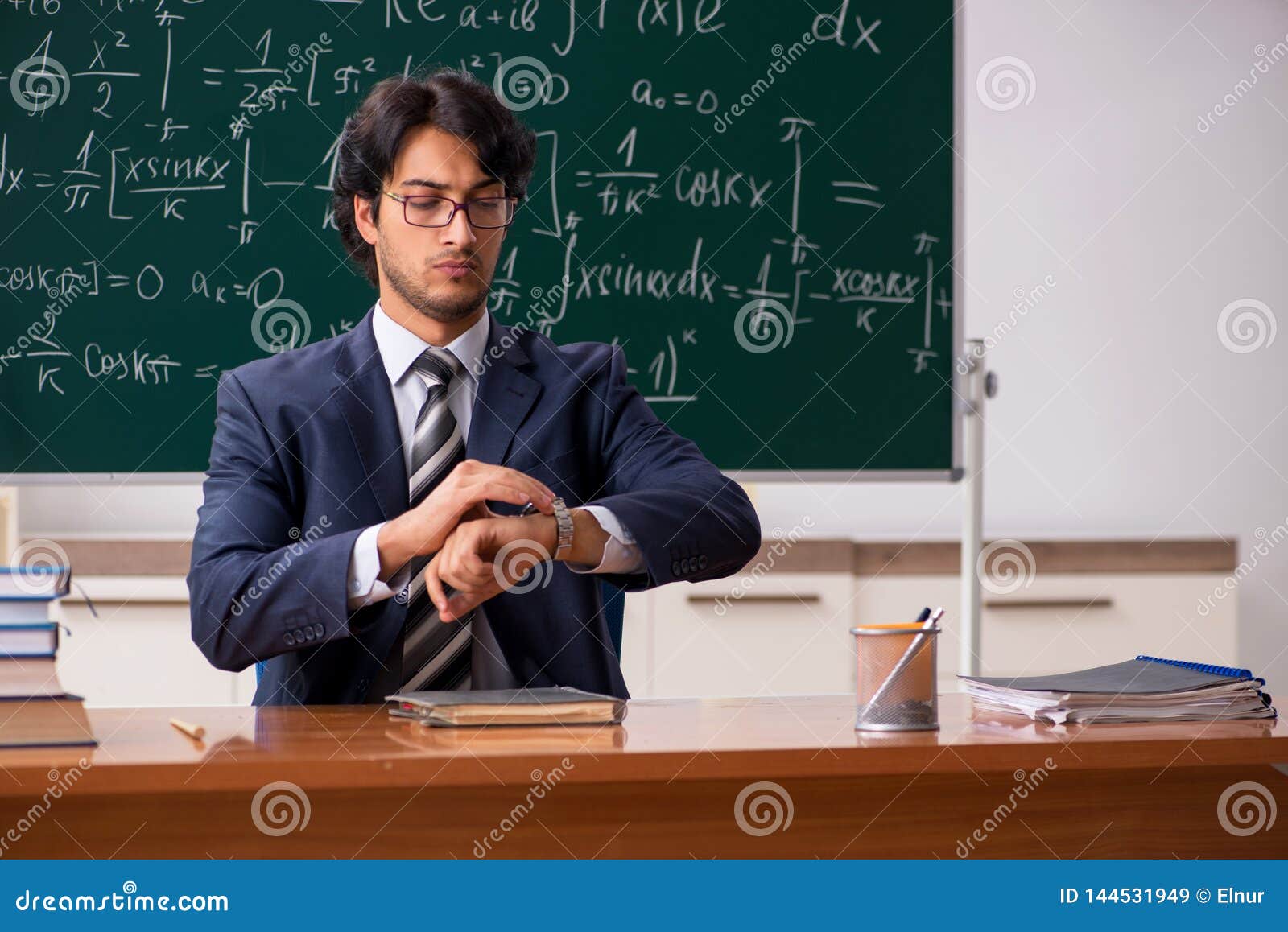 The Young Male Math Teacher in Classroom Stock Image - Image of looking ...