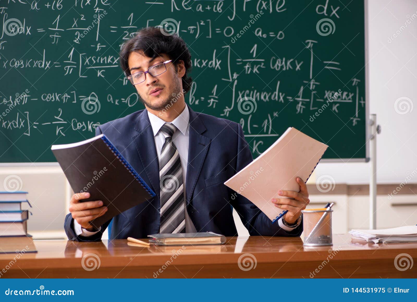 The Young Male Math Teacher in Classroom Stock Image - Image of math ...