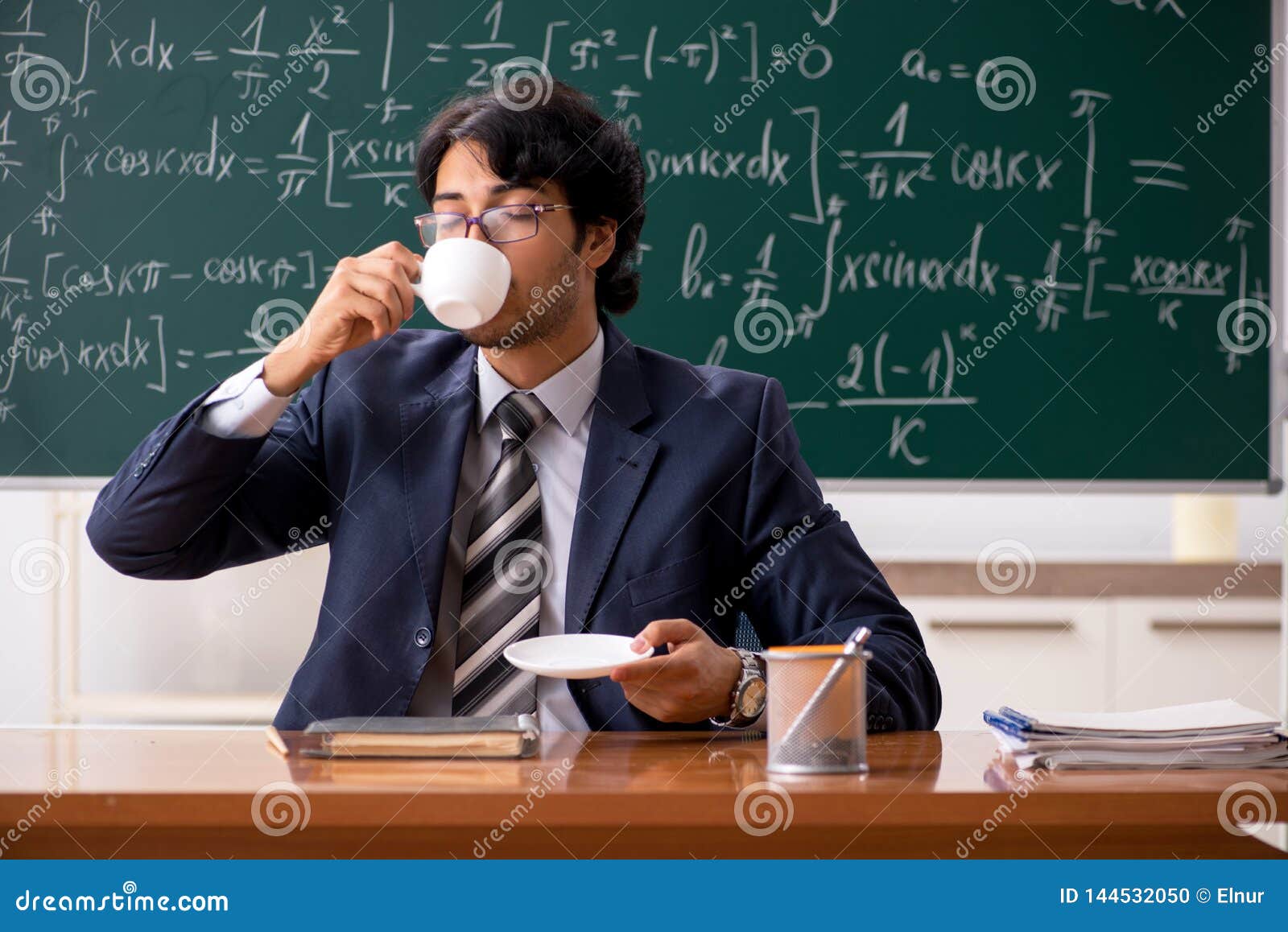 The Young Male Math Teacher in Classroom Stock Photo - Image of coffee ...