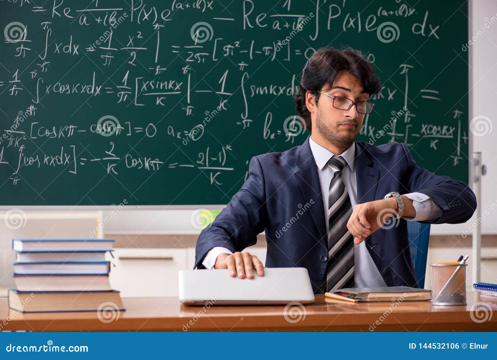 The Young Male Math Teacher in Classroom Stock Photo - Image of looking ...