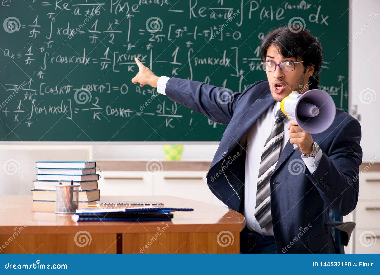 The Young Male Math Teacher in Classroom Stock Photo - Image of ...