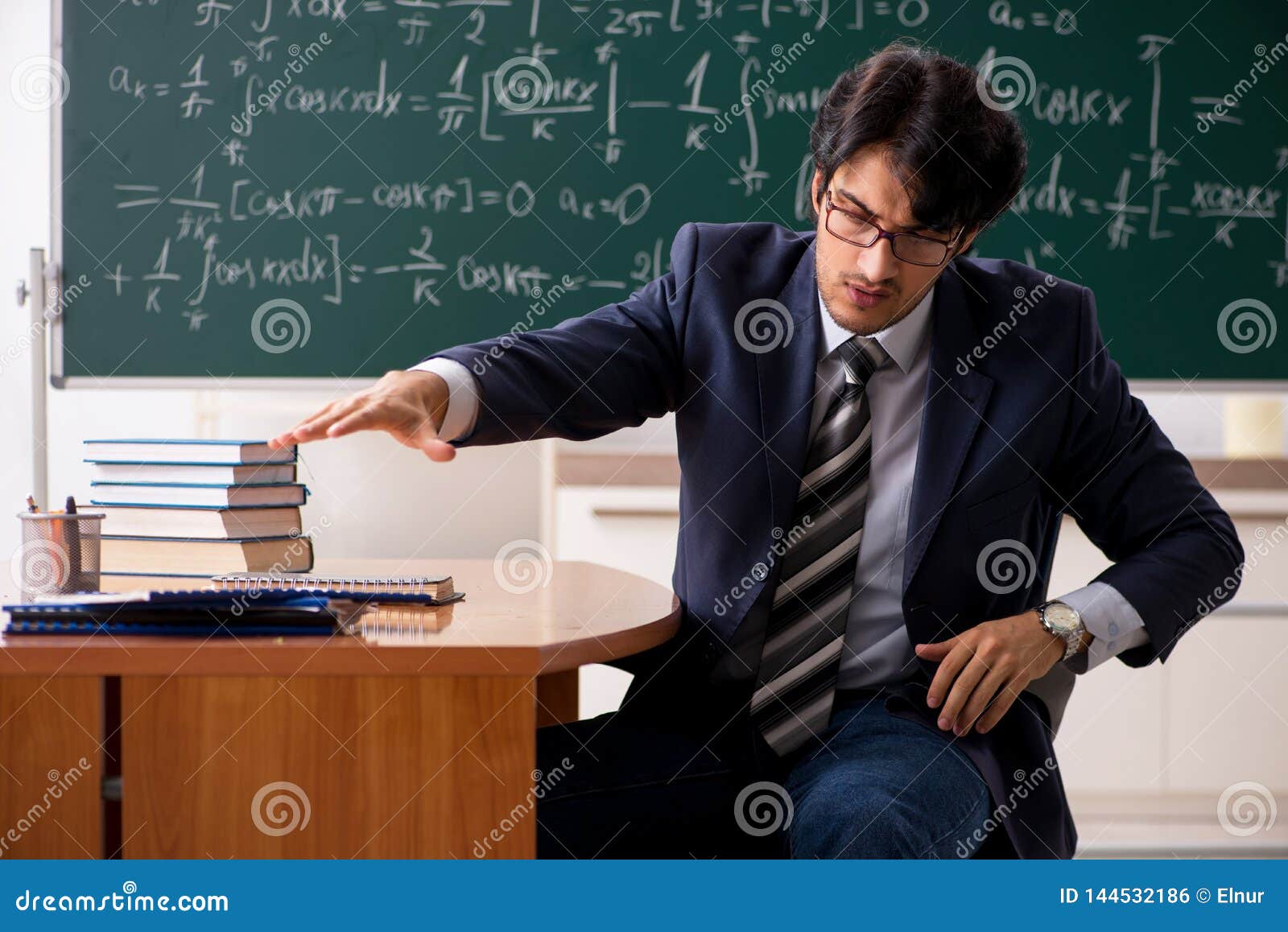 The Young Male Math Teacher in Classroom Stock Photo - Image of ...