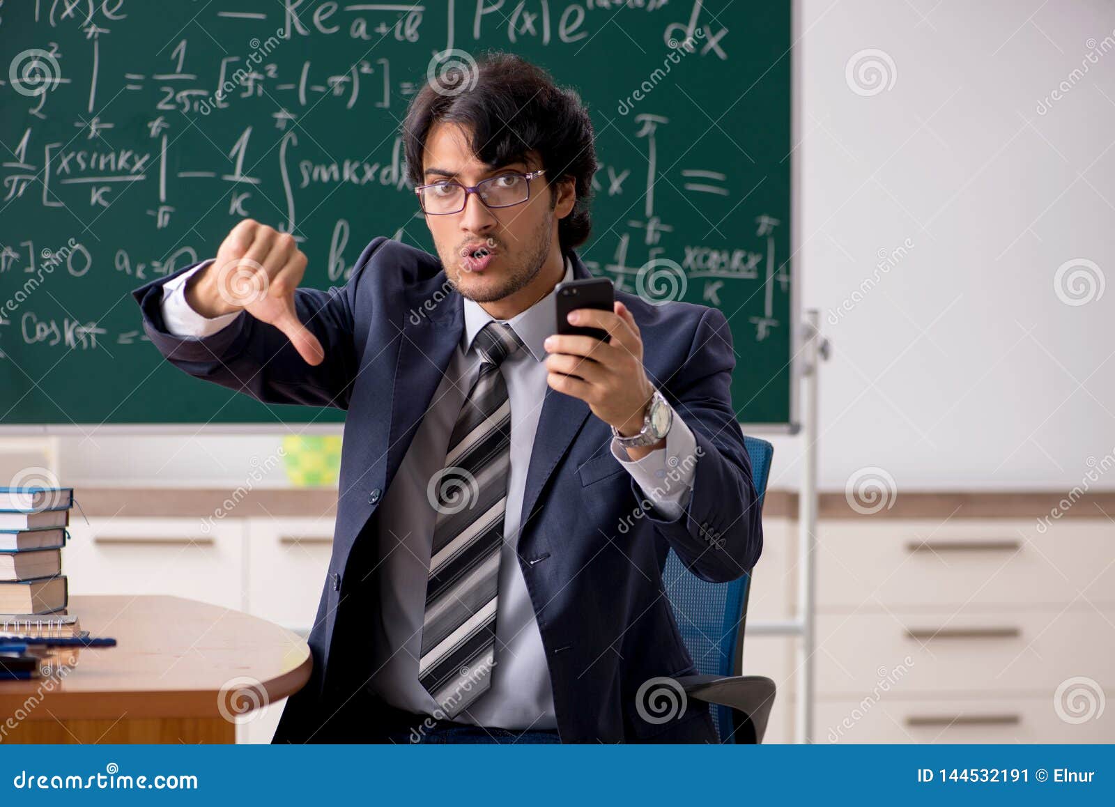 The Young Male Math Teacher in Classroom Stock Image - Image of ...