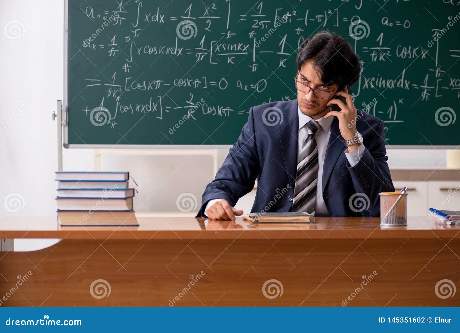 The Young Male Math Teacher in Classroom Stock Photo - Image of ...