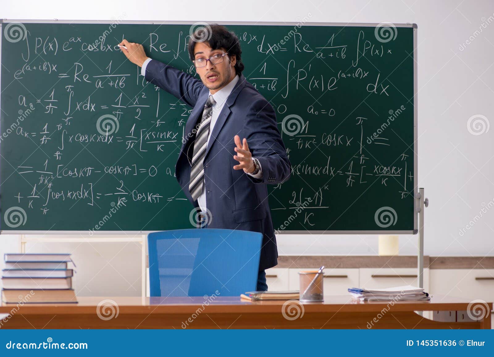 The Young Male Math Teacher in Classroom Stock Photo - Image of ...