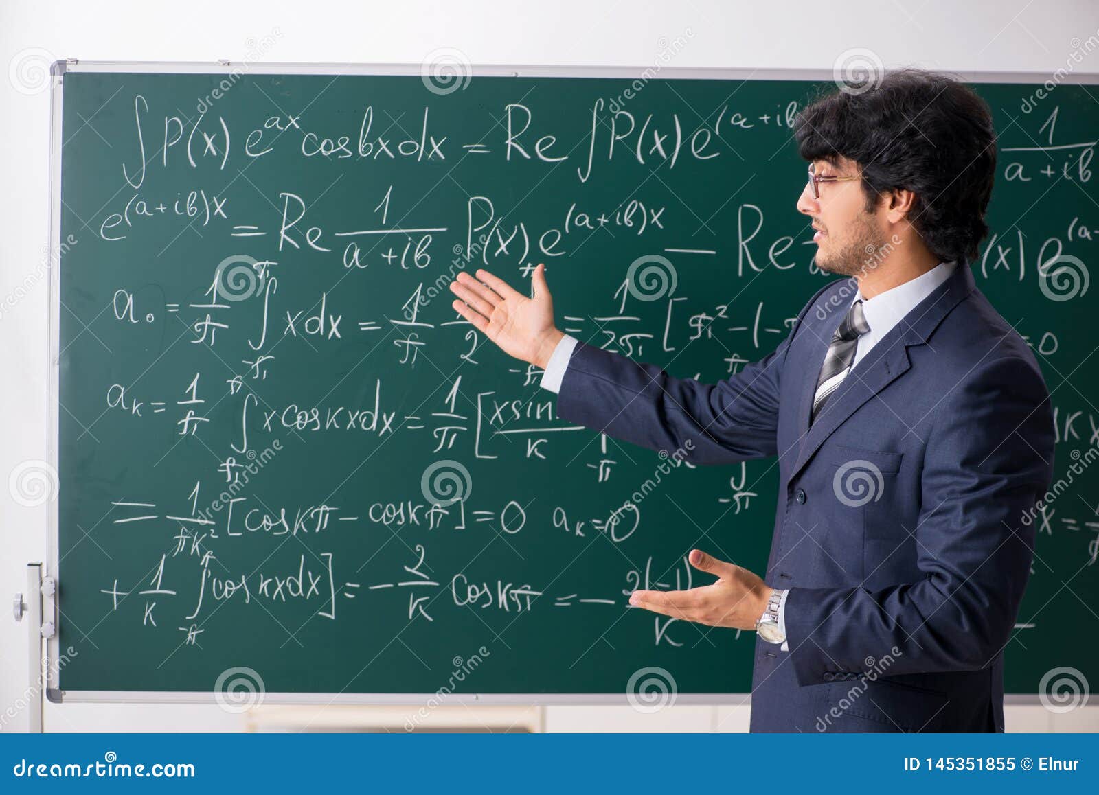 The Young Male Math Teacher in Classroom Stock Image - Image of ...