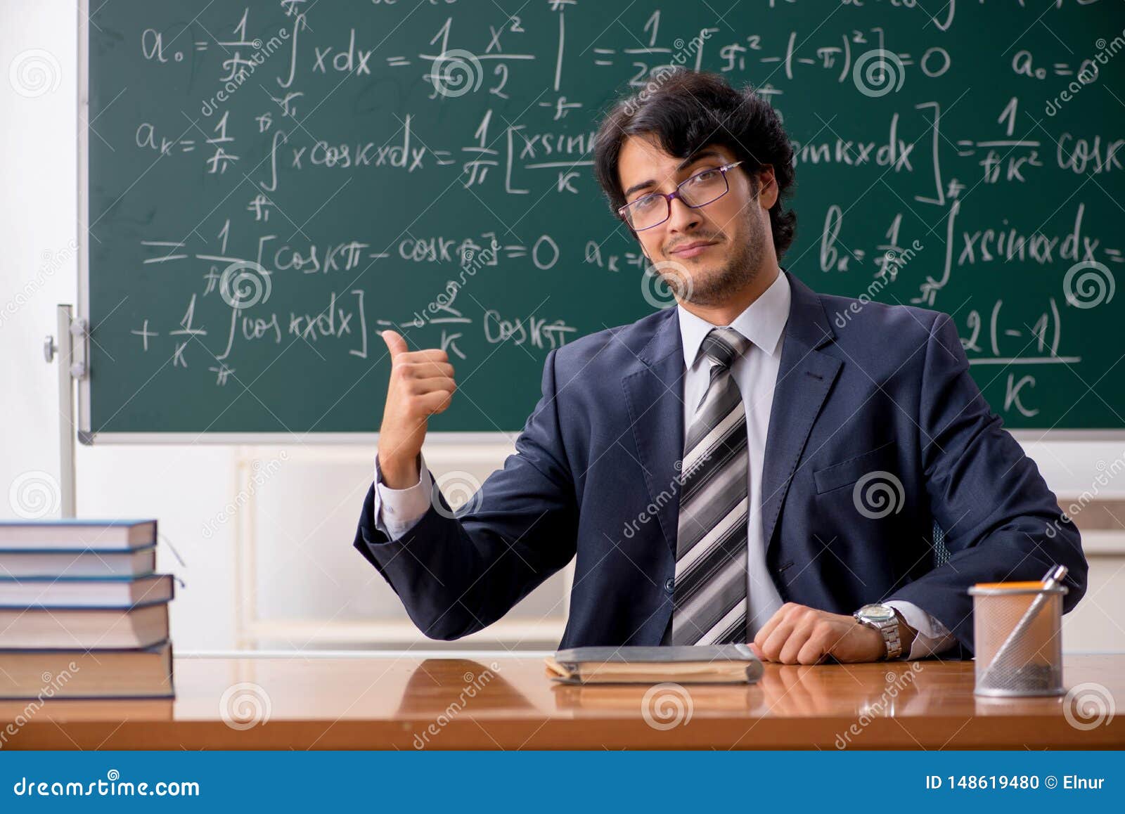 Young Male Math Teacher in Classroom Stock Photo - Image of books, math ...