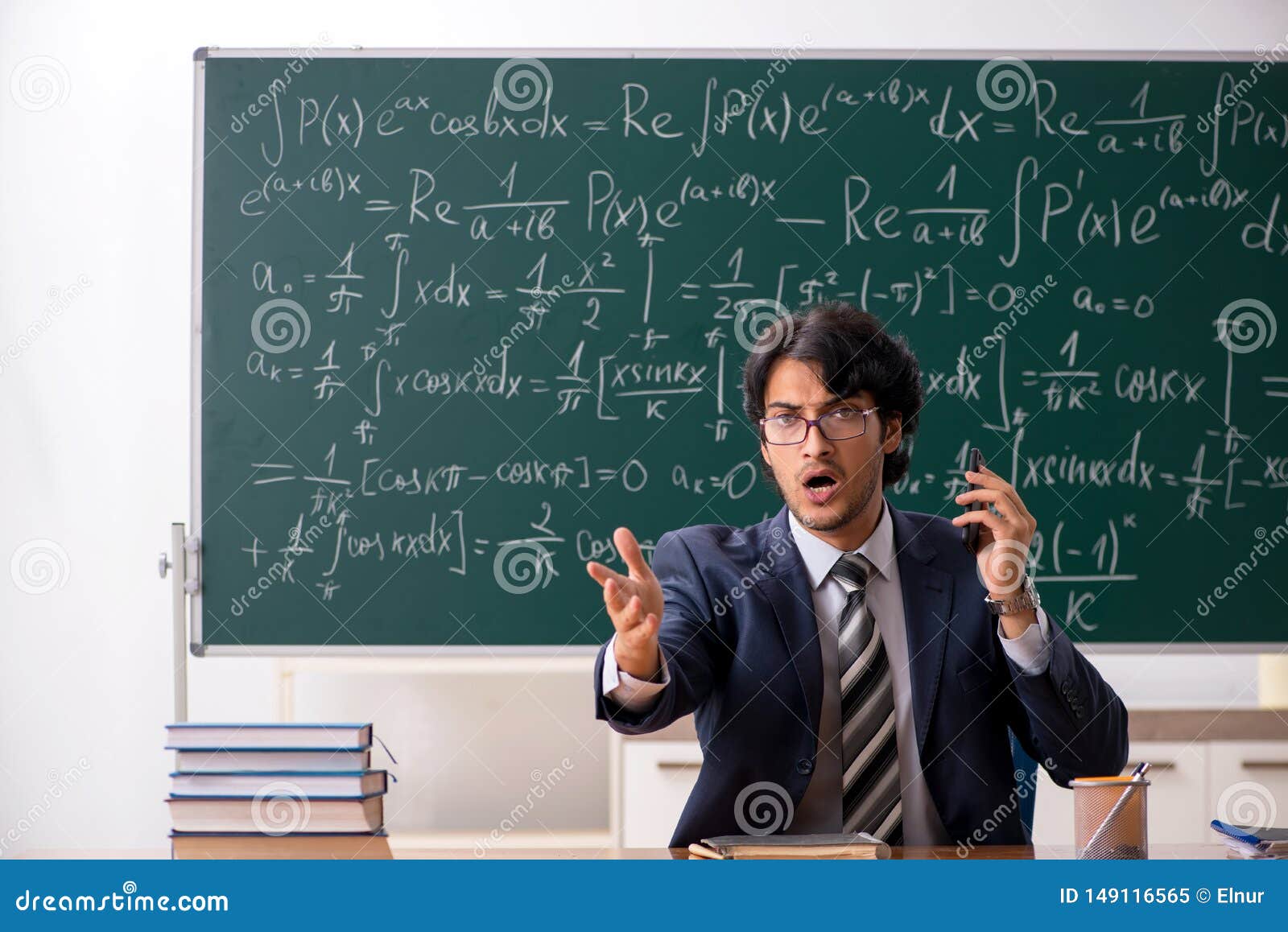 The Young Male Math Teacher in Classroom Stock Image - Image of ...