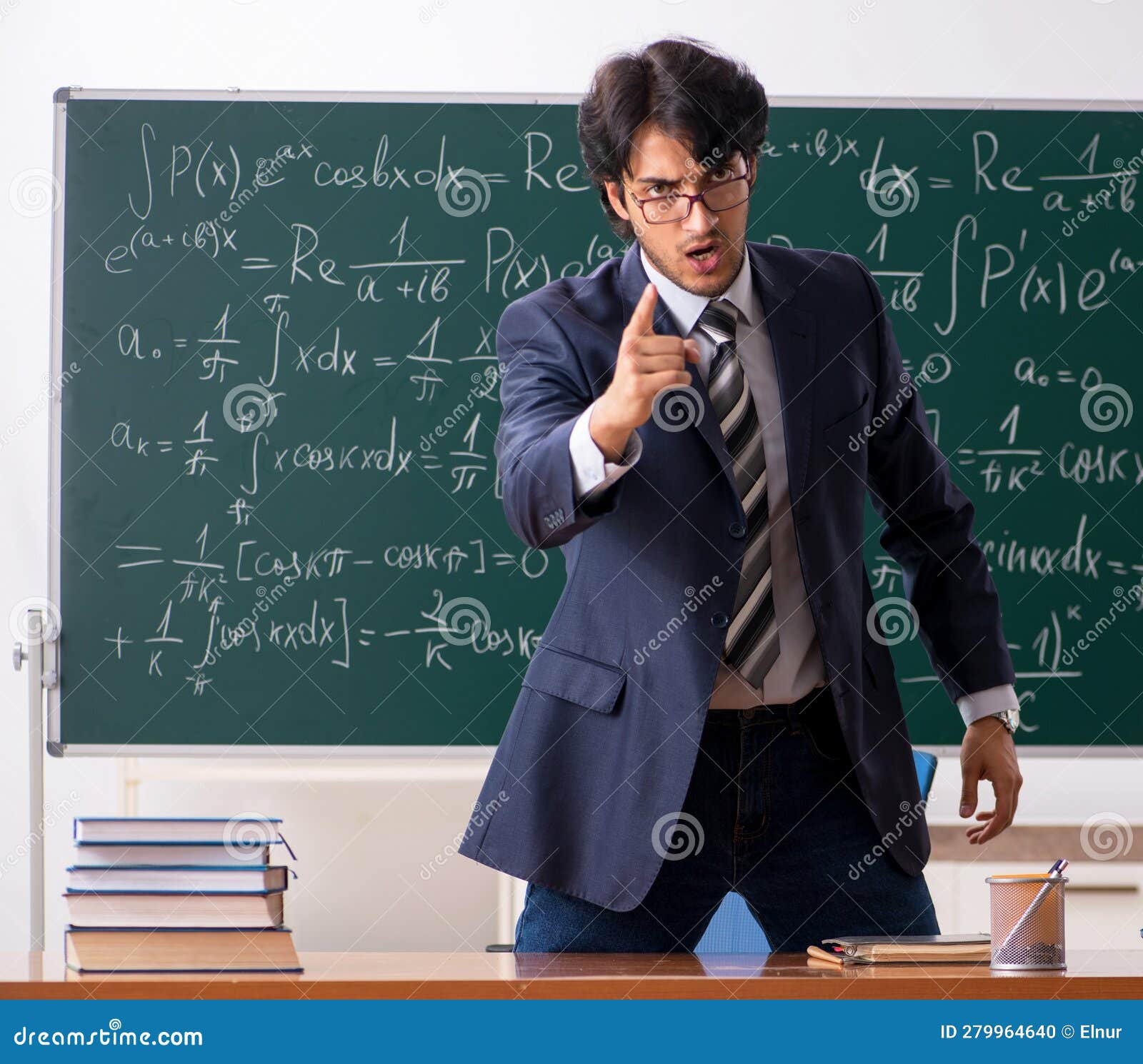 Young Male Math Teacher in Classroom Stock Photo - Image of formula ...