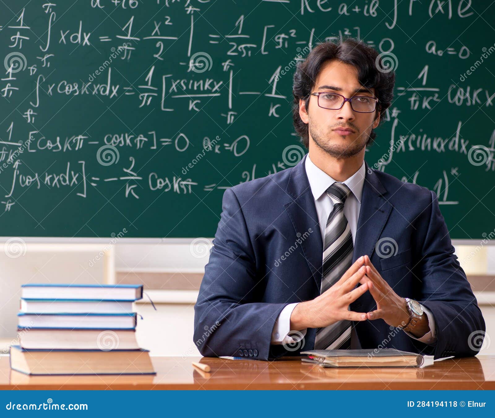 Young Male Math Teacher in Classroom Stock Photo - Image of chalkboard ...