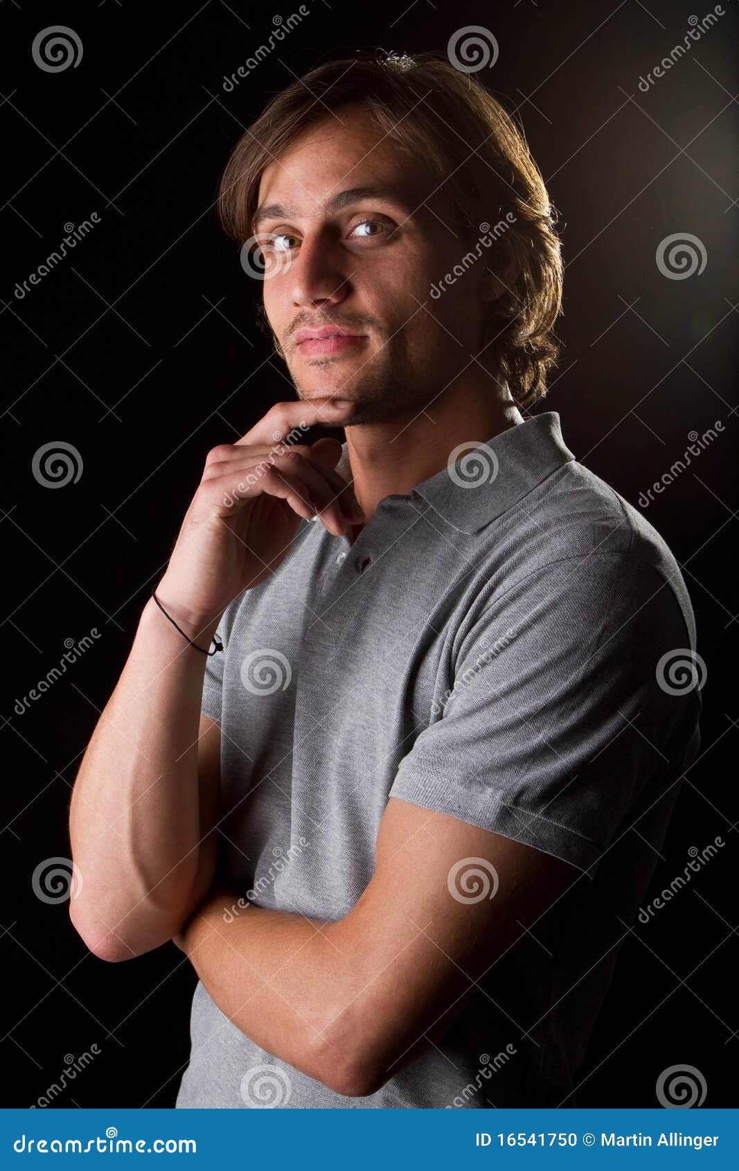 Young Male Model Over Black Background Stock Photo - Image of coat ...