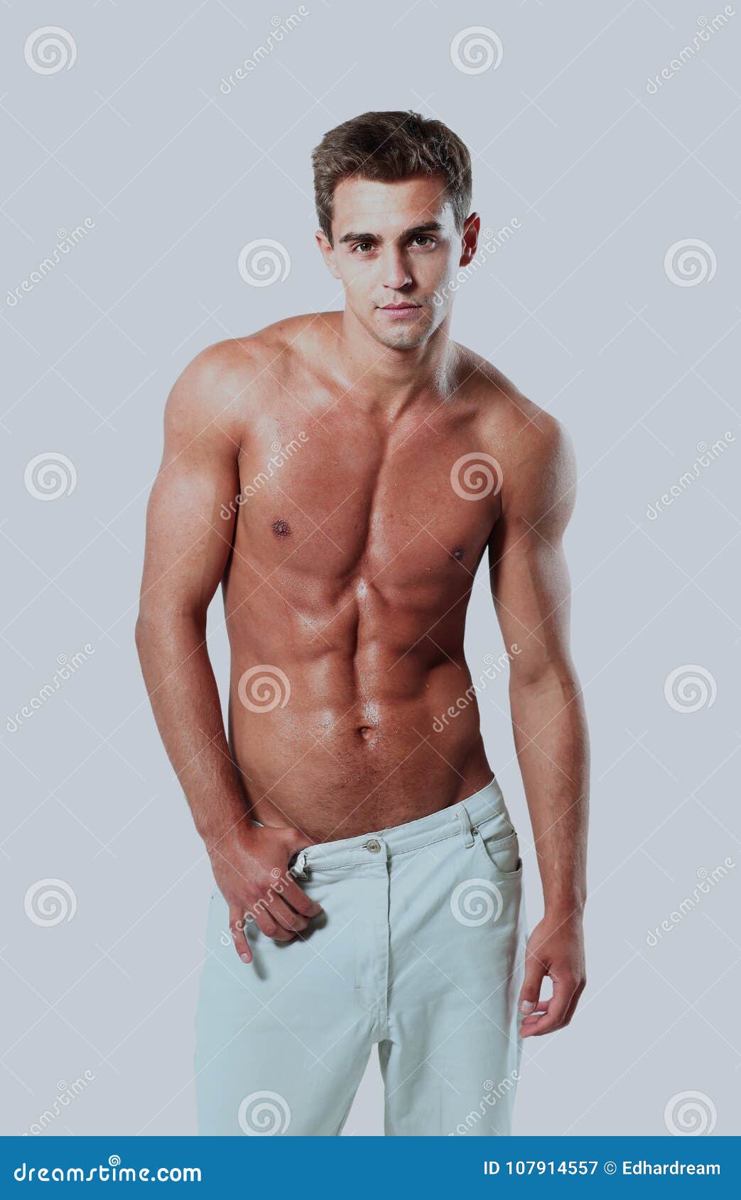 A Young Male Model Posing His Muscles. Stock Image - Image of model ...