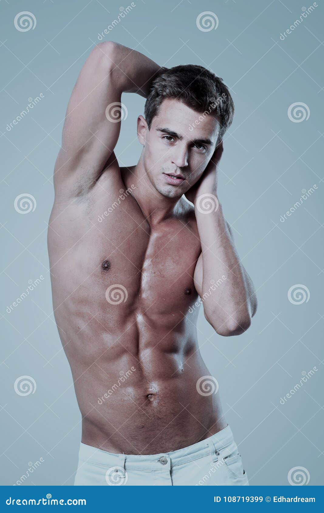 A Young Male Model Posing His Muscles. Stock Image - Image of athlete ...