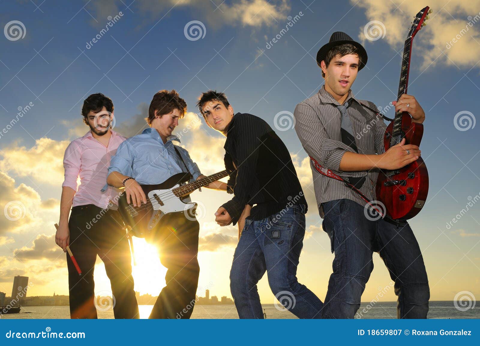 Young Male Musicians with Instruments at Sunset Stock Image - Image of ...