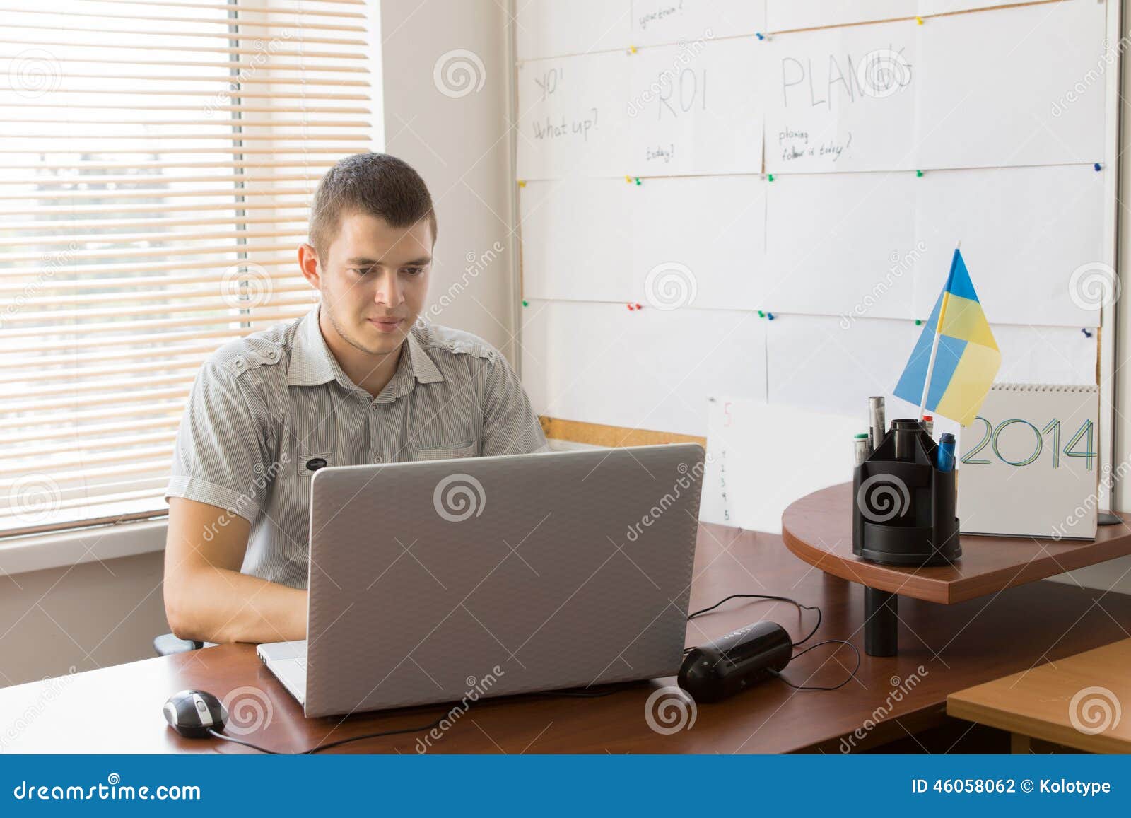 Young Male Office Worker Busy with His Laptop Stock Photo - Image of ...