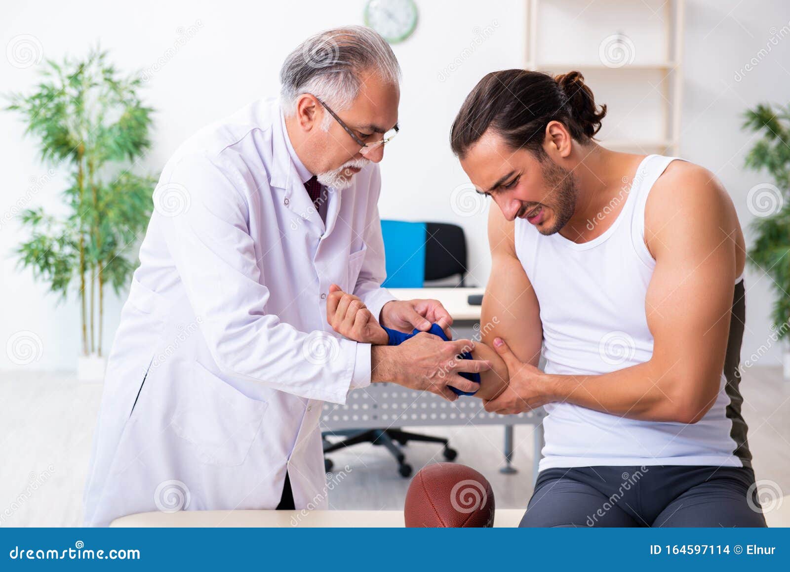 Young Male Patient Visiting Experienced Doctor Stock Photo - Image of ...