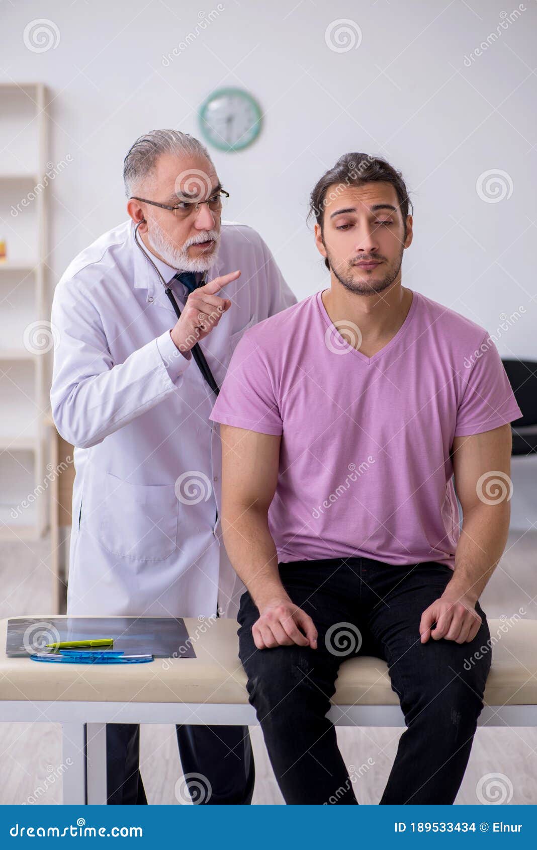 Young Male Patient Visiting Old Male Doctor Stock Photo - Image of care ...