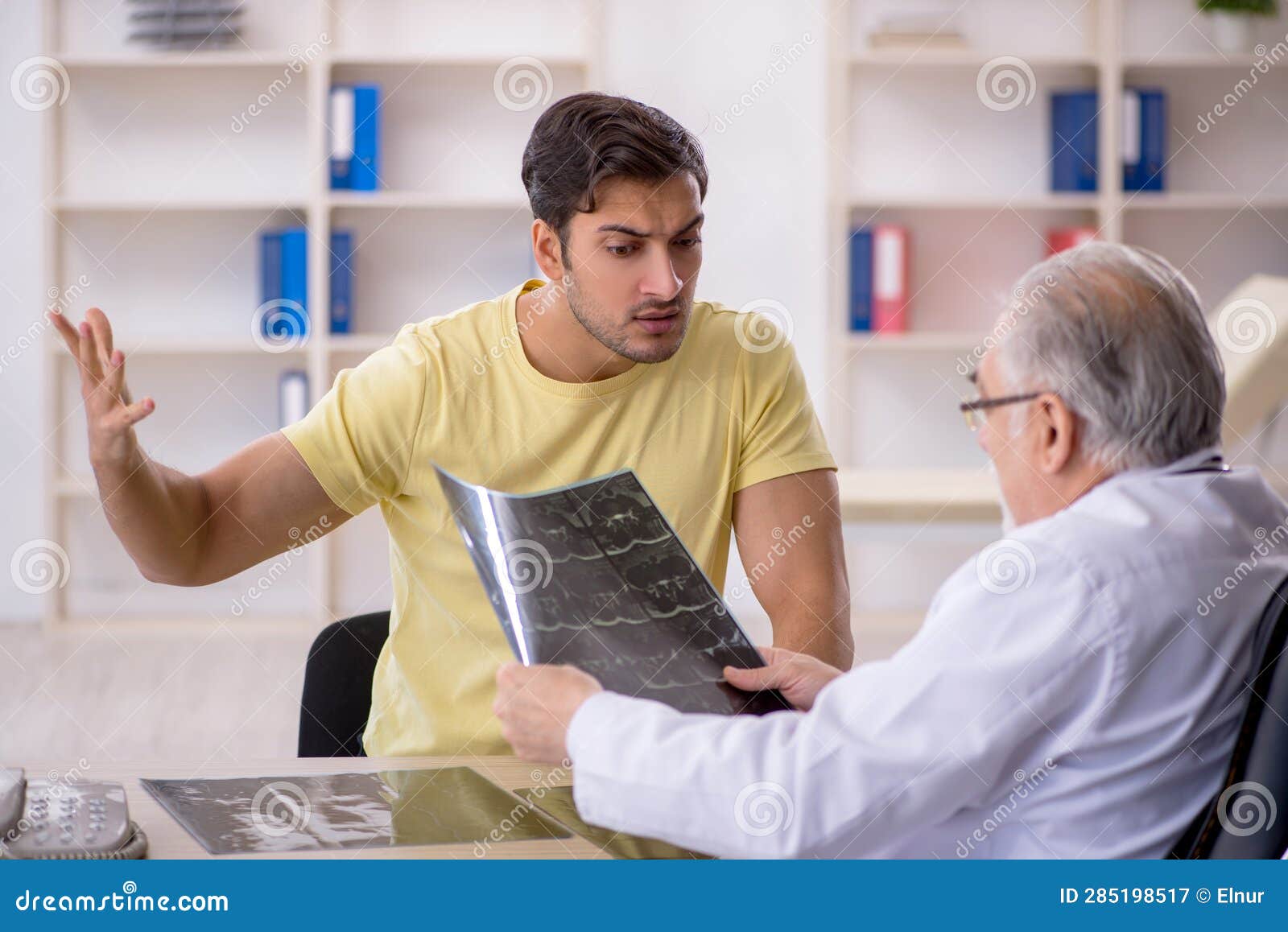Young Male Patient Visiting Old Male Doctor Stock Image - Image of ... Young Male Patient Visiting Old Male Doctor Stock Image - Image of ...