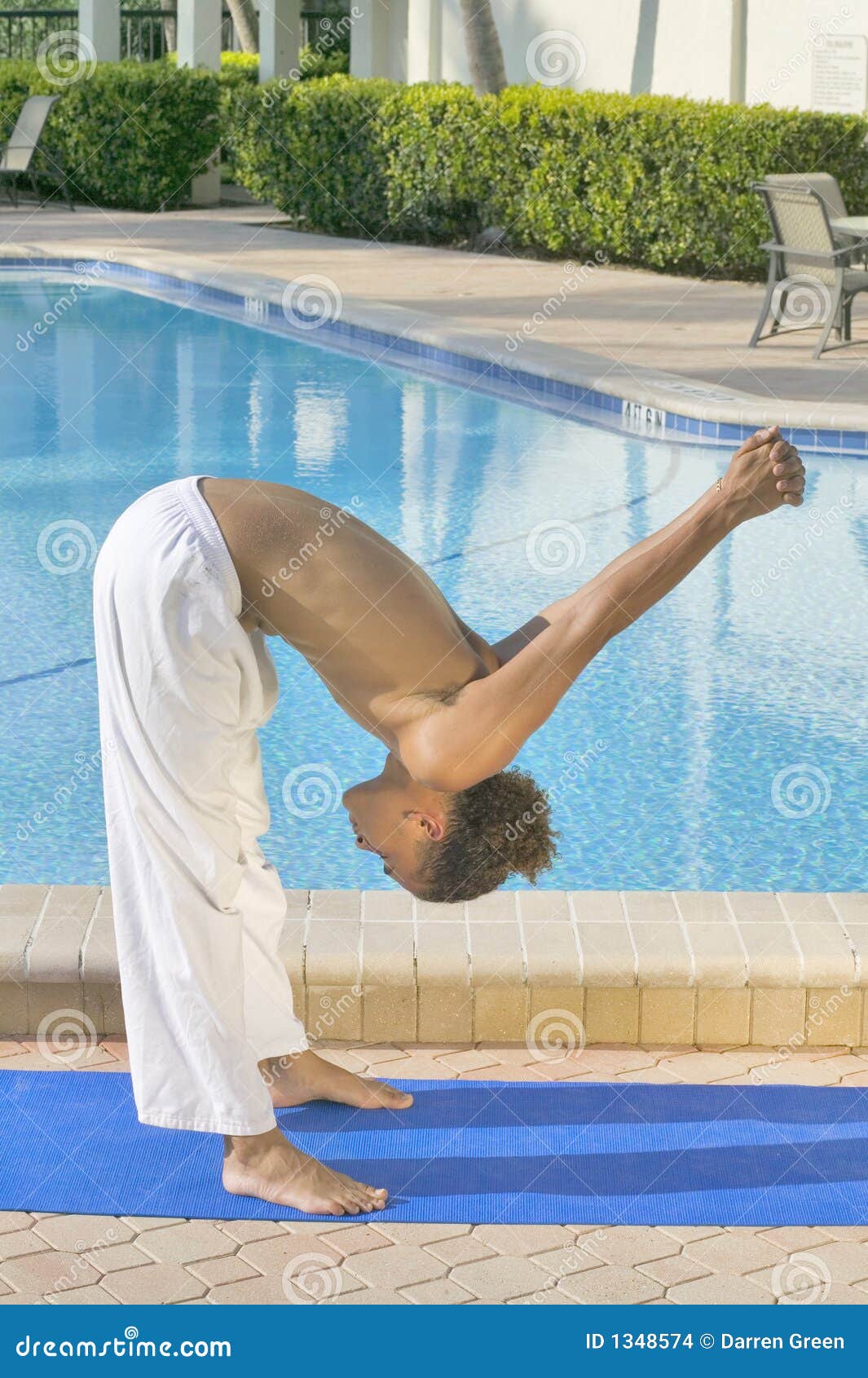 Young male practicing Yoga stock photo. Image of buff - 1348574