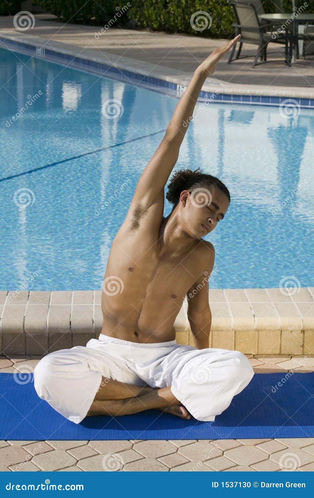 Young male practicing Yoga stock photo. Image of buff - 1537130