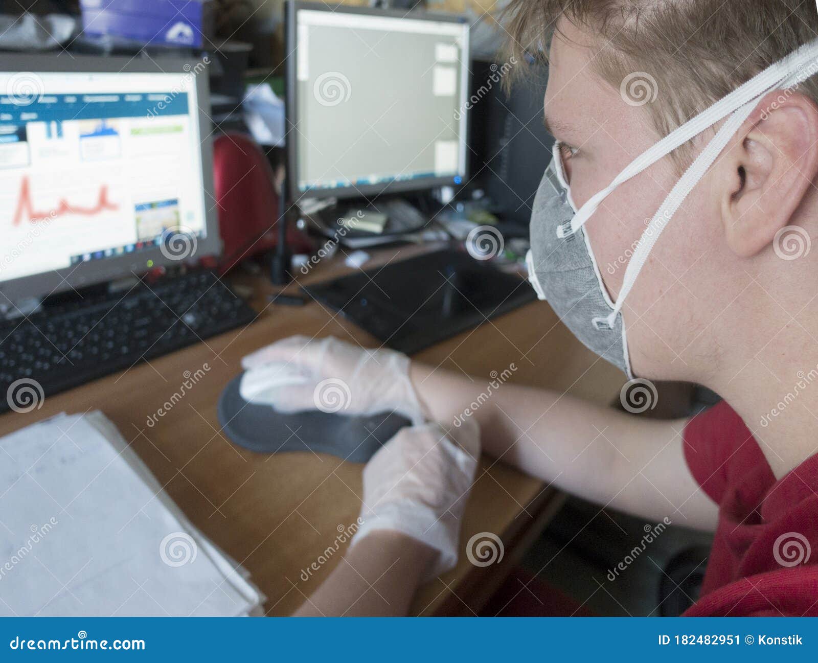Young Male Programmer Working at a Computer in a Protective Mask and ...