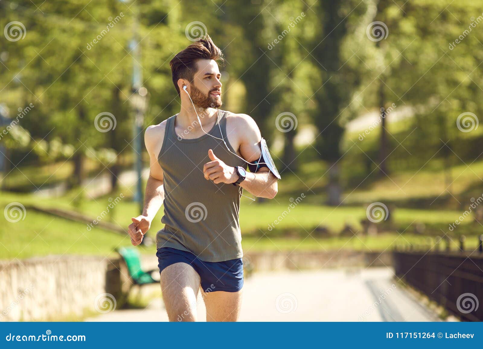 A Young Male Runner Jogs in the Park Stock Photo - Image of summer ...