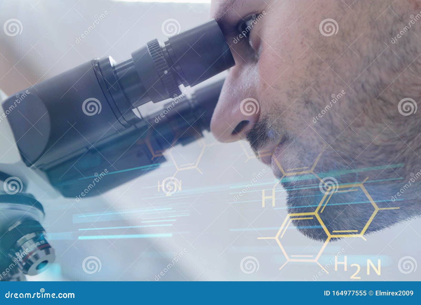 Young Male Male Scientist Looking through a Microscope in a Labo Stock ...