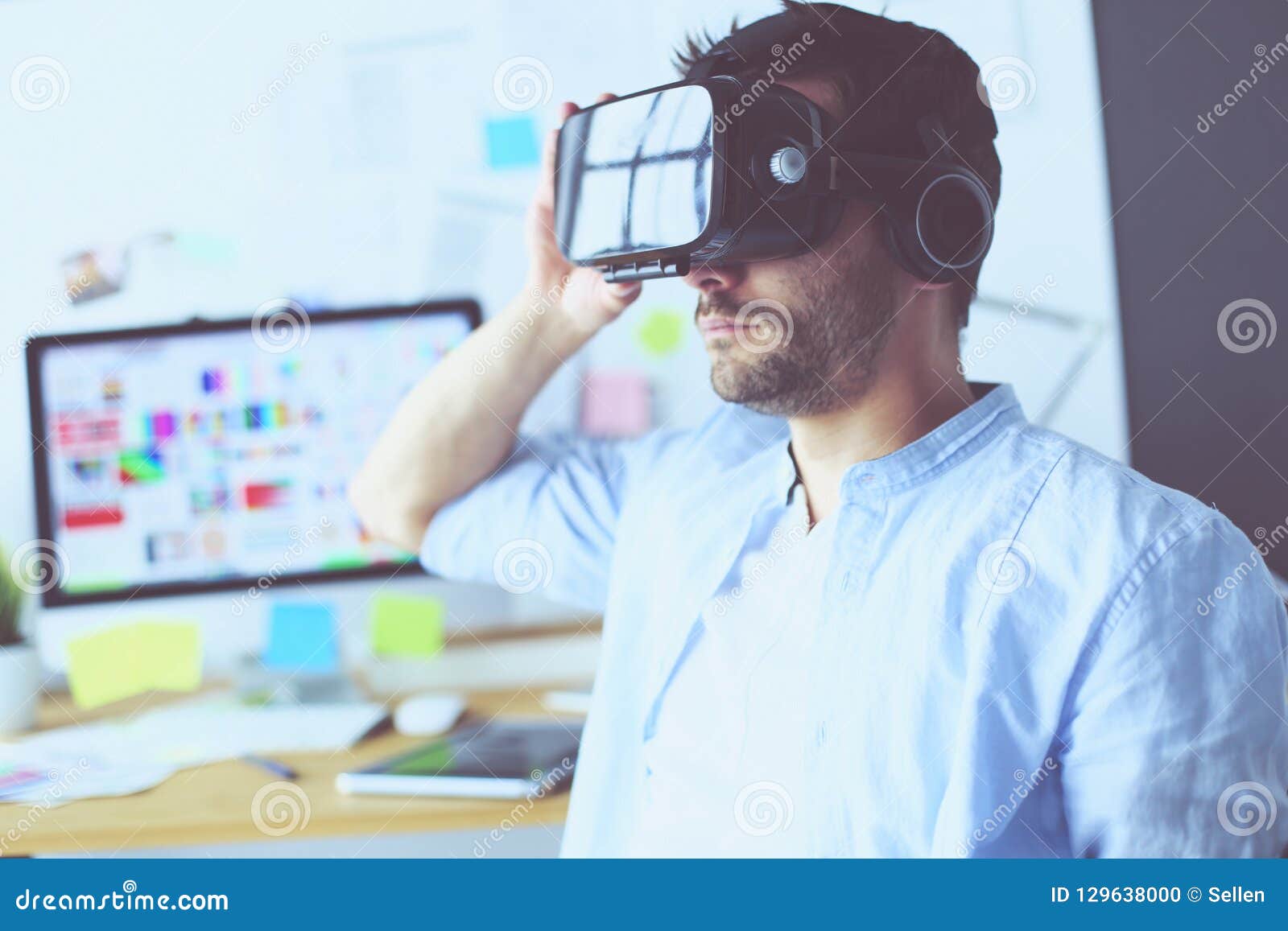 Young Male Software Programmer Testing a New App with 3d Virtual ...