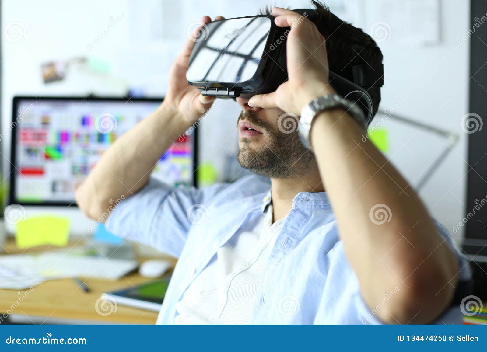 Young Male Software Programmer Testing a New App with 3d Virtual ...