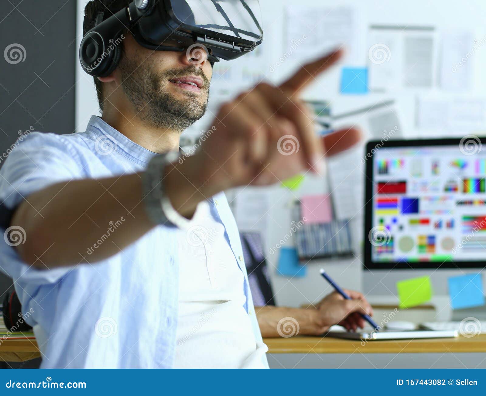 Young Male Software Programmer Testing a New App with 3d Virtual ...
