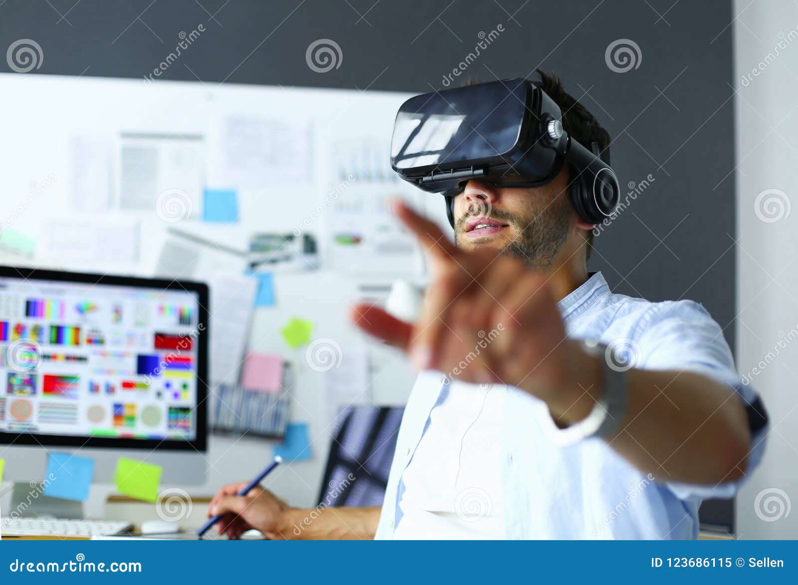Young Male Software Programmer Testing a New App with 3d Virtual ...
