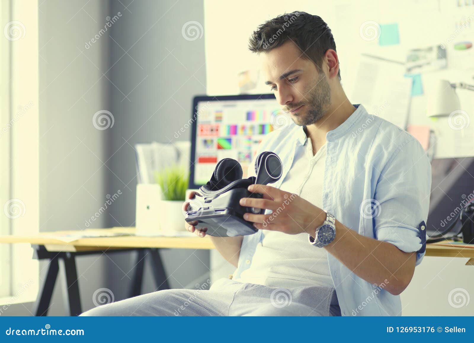 Young Male Software Programmer Testing a New App with 3d Virtual ...