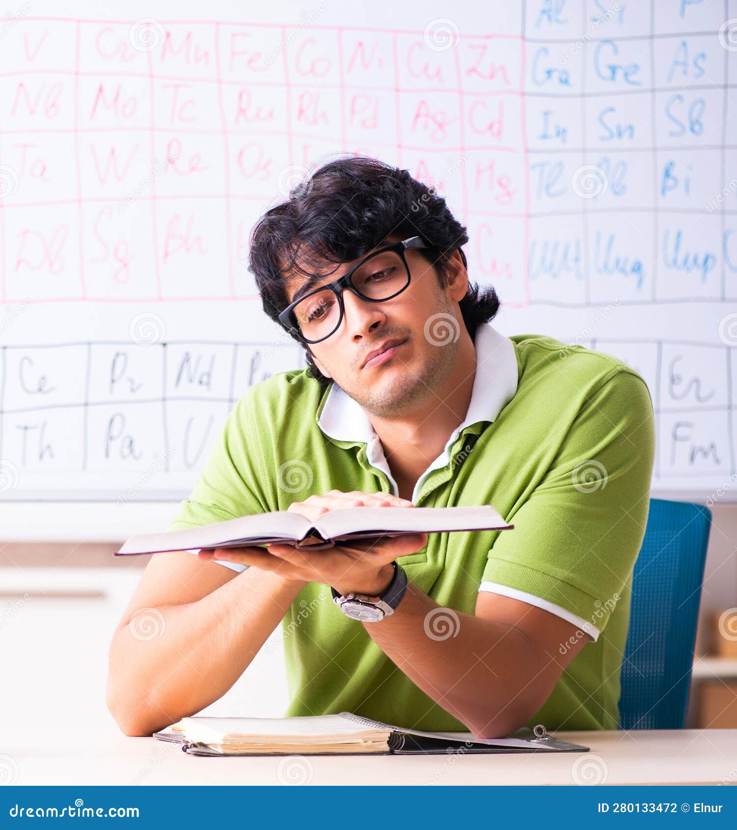 Young Male Student Chemist in Front of Periodic Table Stock Photo ...