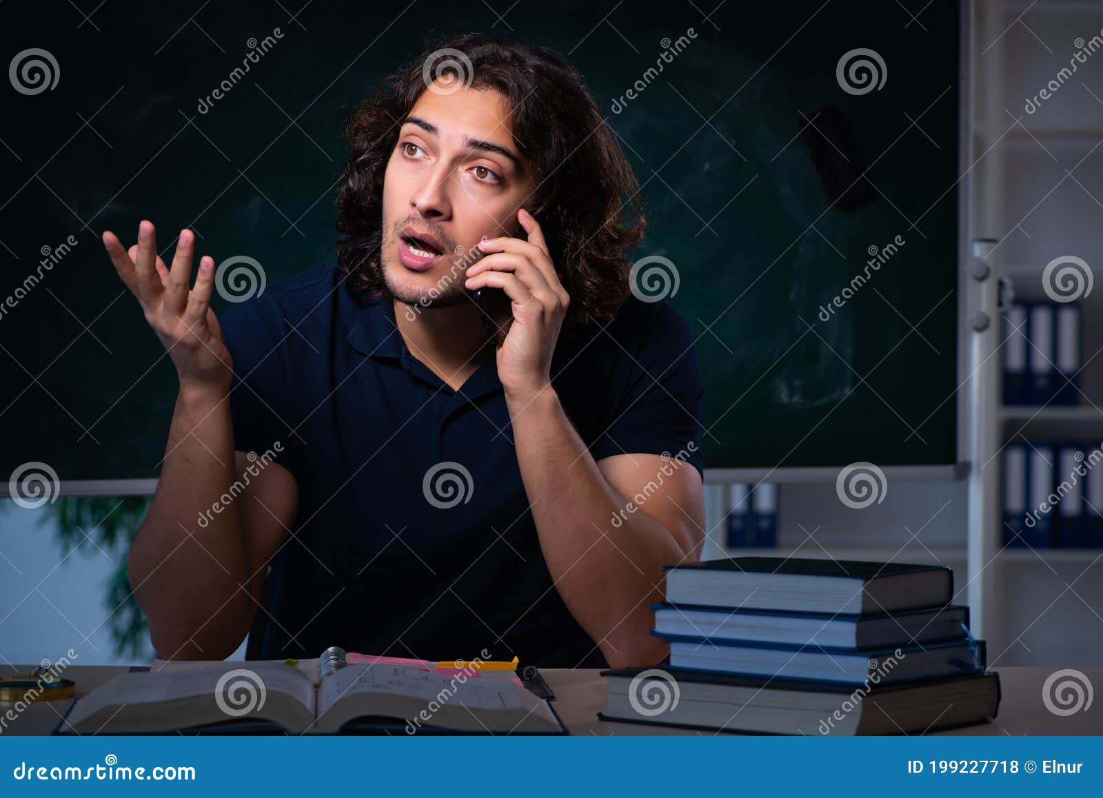 Young Male Student in the Classroom at Night Stock Photo - Image of ...