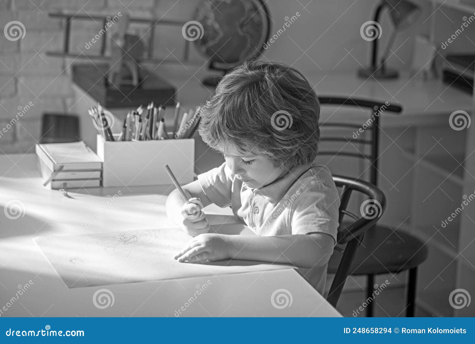 Young Male Student Drawing with Pencil at the Classroom. Stock Photo ...