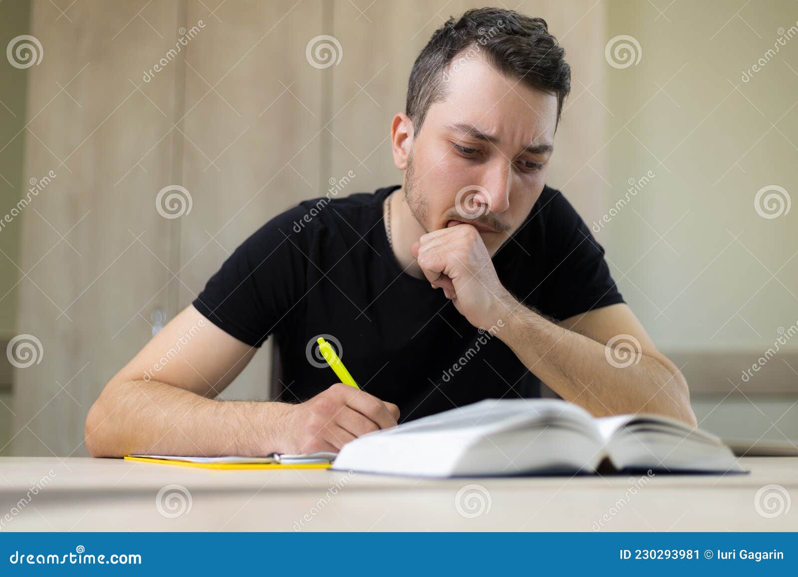 Male Student in the Learning Process with a Pen and Abstract Stock ...