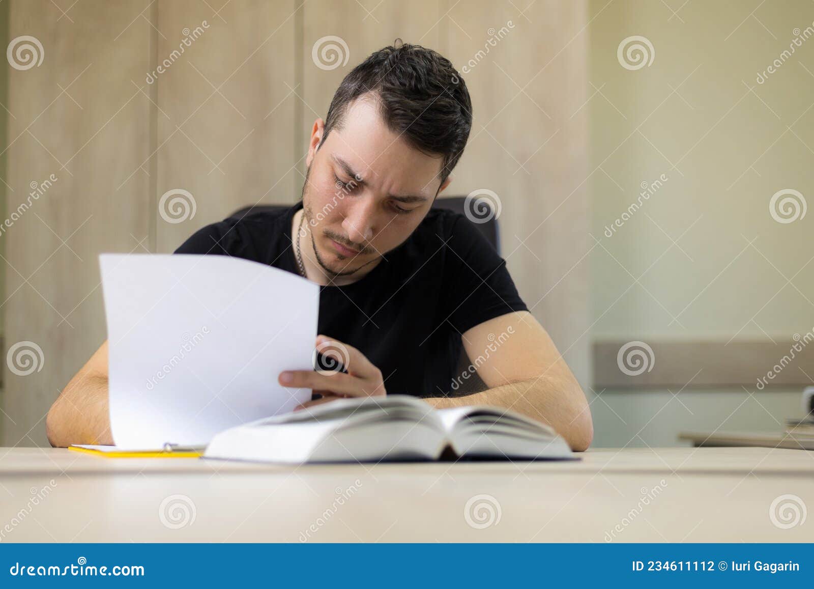 Male Student in the Learning Process with a Pen and Abstract Stock ...