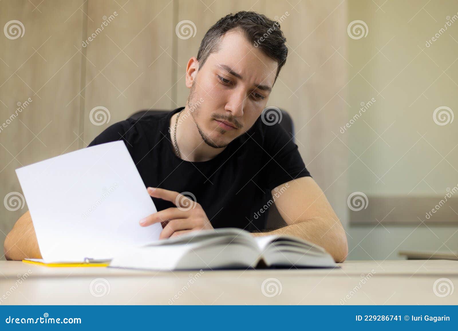 Male Student in the Learning Process with a Pen and Abstract Stock ...