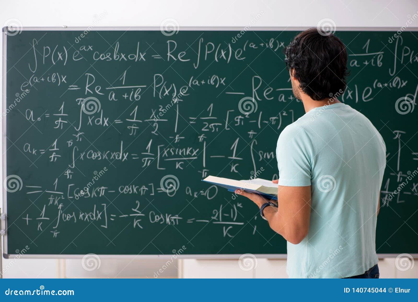 The Young Male Student Mathematician in Front of Chalkboard Stock Photo ...