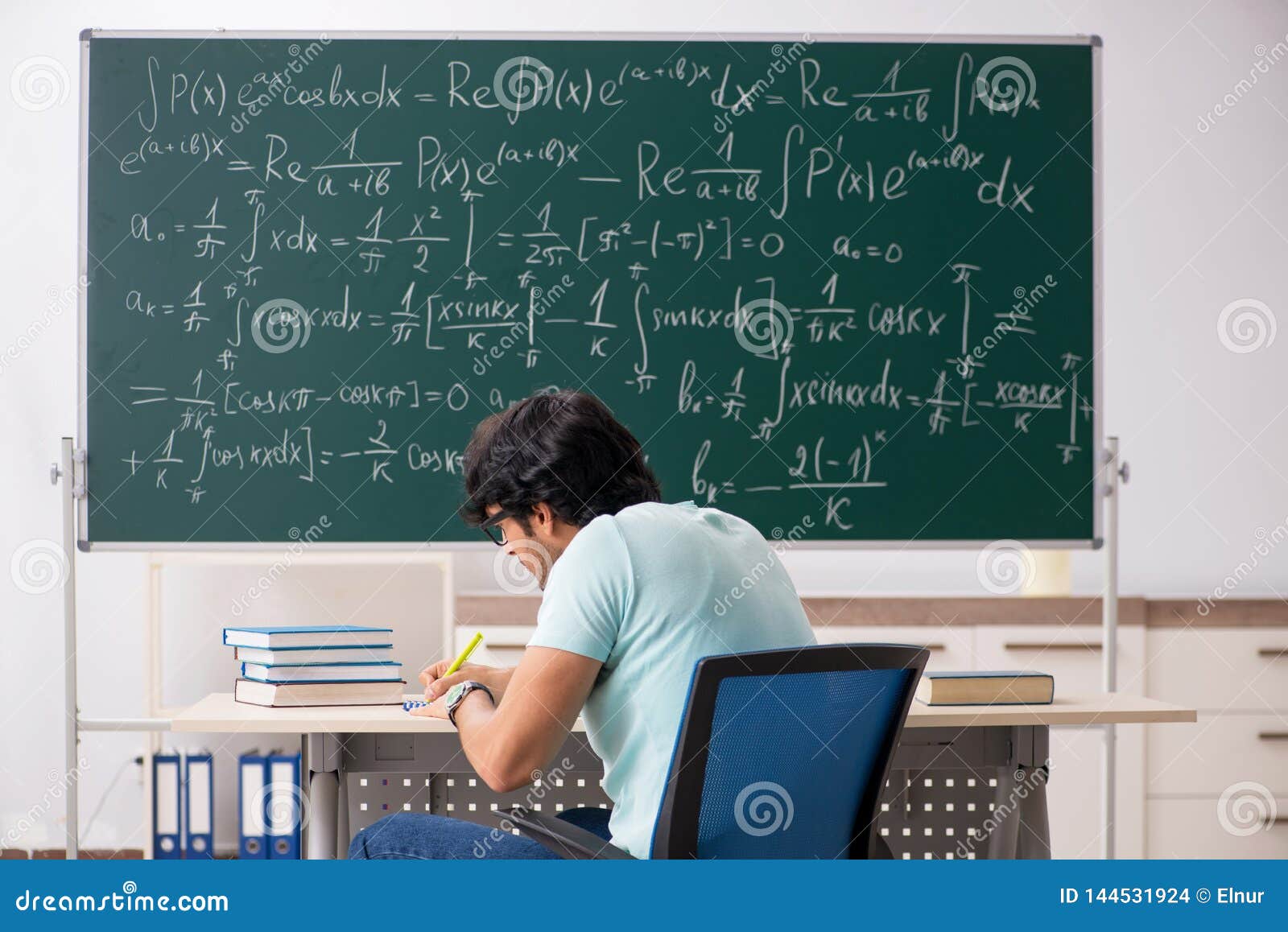 The Young Male Student Mathematician in Front of Chalkboard Stock Photo ...