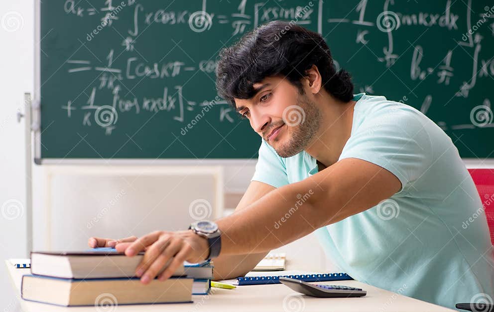 Young Male Student Mathematician in Front of Chalkboard Stock Photo ...