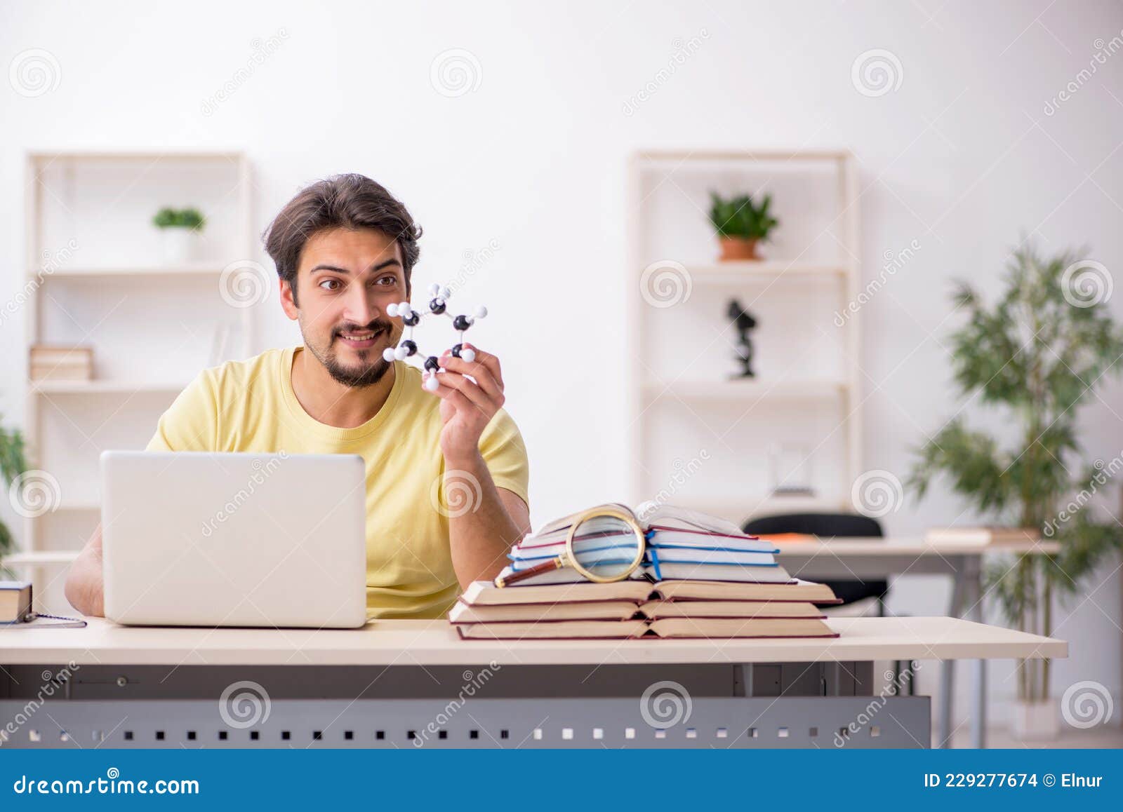 Young Male Student Physics Looking at Molecular Model Stock Photo ...