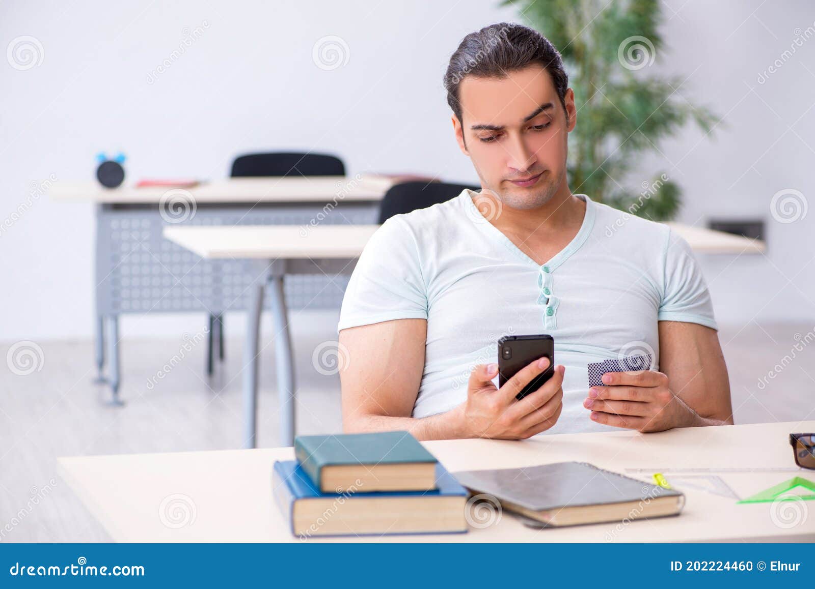 Young Male Student Playing Cards during Exam Preparation in the Stock ...