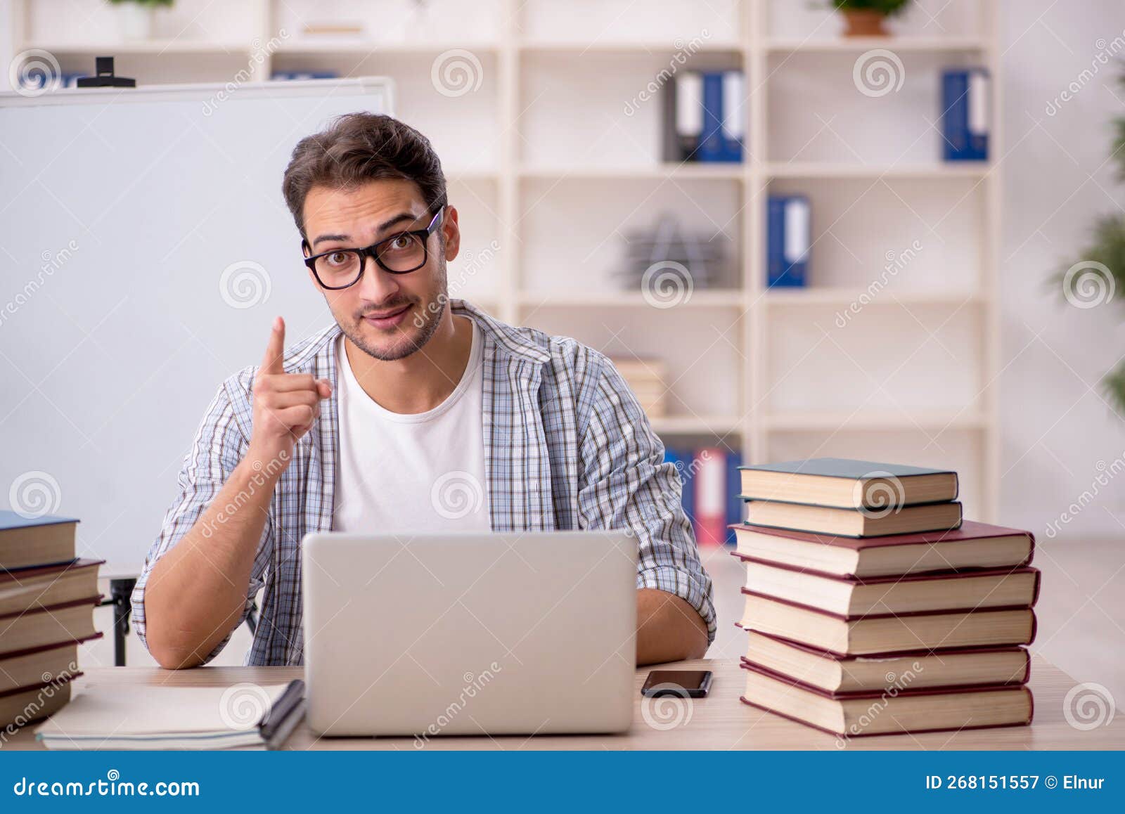 Young Male Student Preparing for Exams in the Classroom Stock Image ...