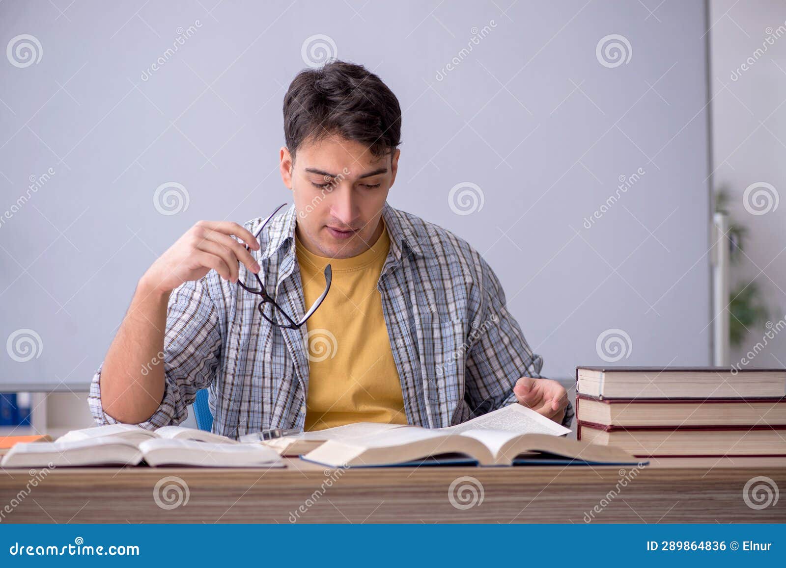 Young Male Student Preparing for Exams in the Classroom Stock Photo ...