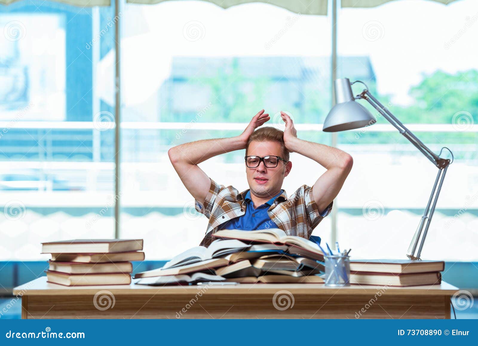 The Young Male Student Preparing for High School Exams Stock Photo ...