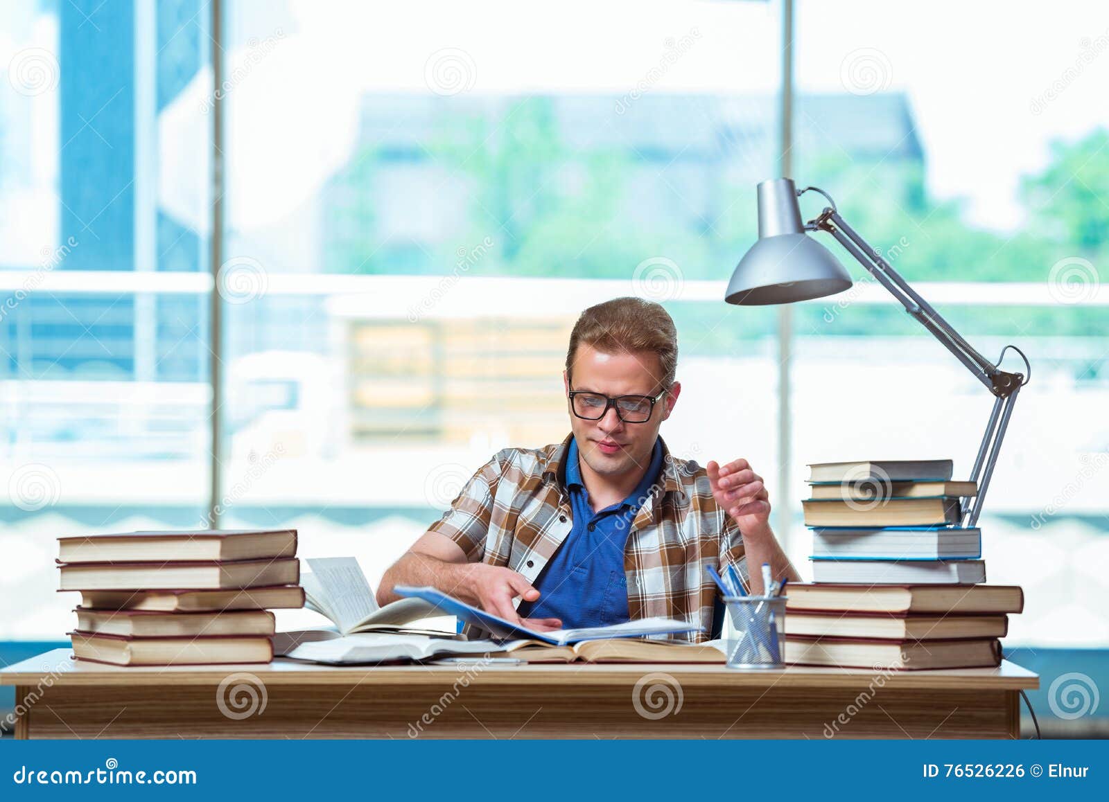 The Young Male Student Preparing for High School Exams Stock Photo ...