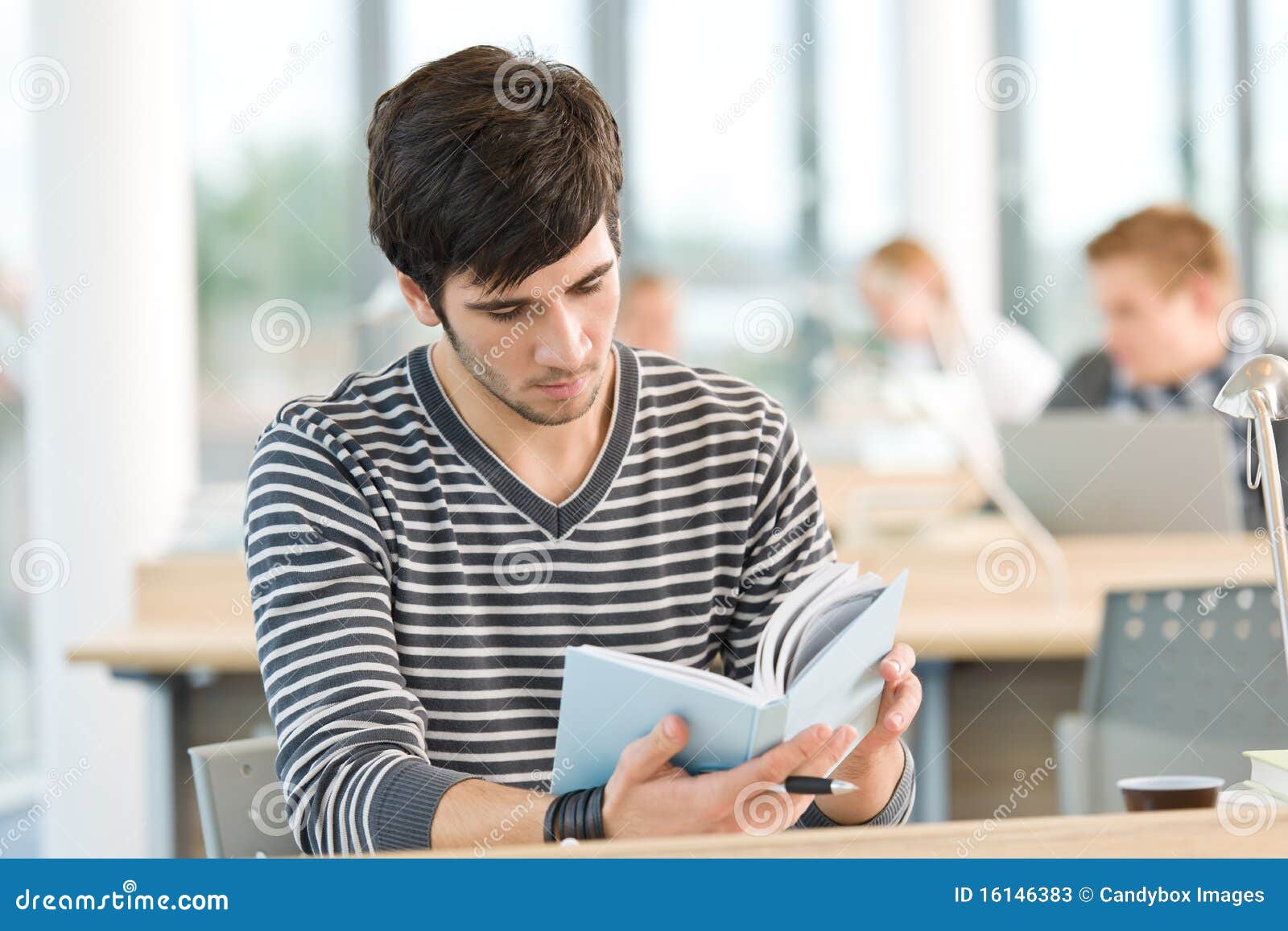 Young Male Student Read Book in Classroom Stock Image - Image of ...